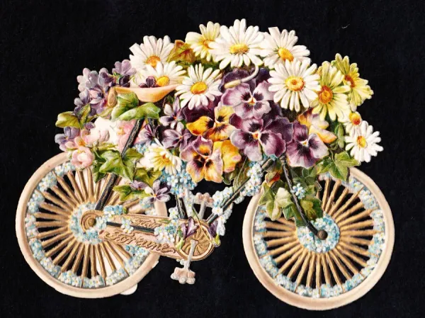 Bicycle covered in flowers on a cutout greetings card