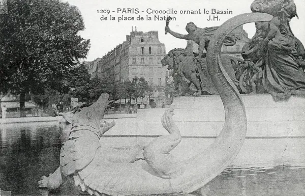 Crocodile statue in the fountain pool Place de la Nation