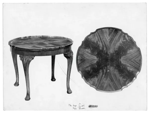 Walnut circular table from a furniture showroom catalogue