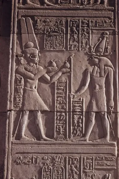 Ptolemaic low relief of the hawk-headed god Horus presented