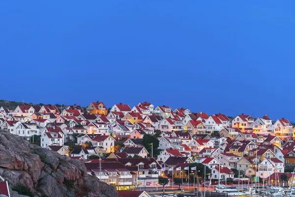 Traditional illuminated village of Kungshamn at dusk