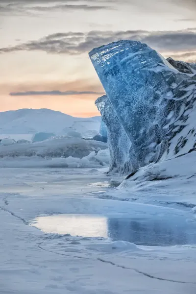 Iceberg frozen in the sea ice off Spitsbergen East Coast