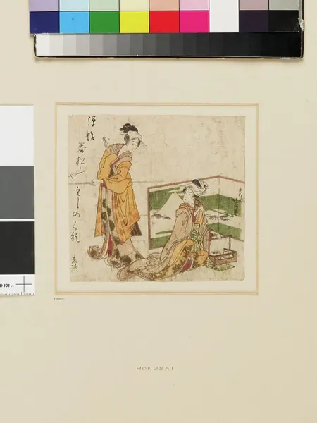 Two women in front of a screen depicting Mount Fuji