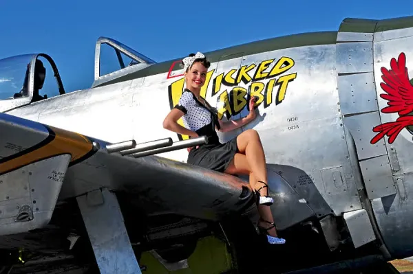 1940s Style Pin Up Girl Sitting On Top Of A P 47d Our Beautiful Wall
