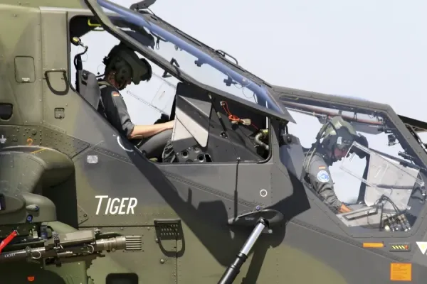 Pilots prepare for a mission in the Tiger Eurocopter of