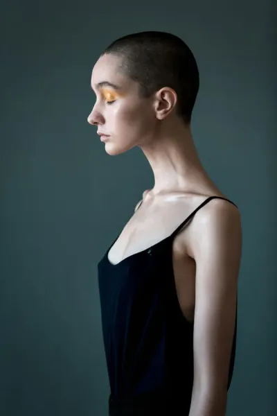 she. portrait of a model with short dark hair on natural